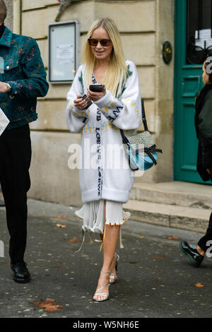 A trendy woman poses for street snap during the Paris Fashion Week ...