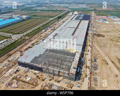 An aerial view of the Tesla Gigafactory 3 under construction in Lingang ...