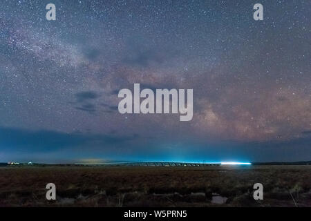 Landscape of the starry sky above the Xingkai Lake on the border ...