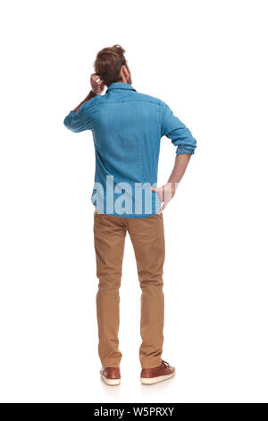 Confused guy scratch head and look aside at logo puzzled, holding red ...