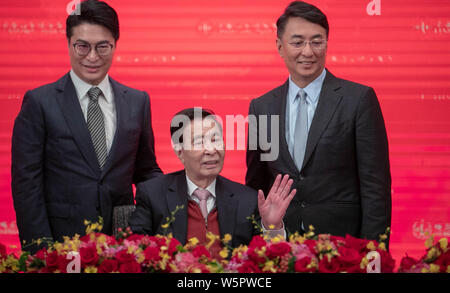 Lee Shau Kee, center, chairman of Henderson Land Development Co., and ...
