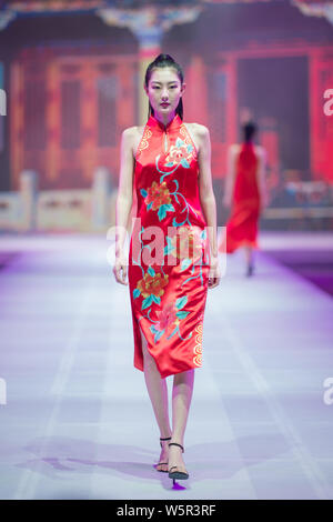 A model dressed in Cheongsam, a traditional Chinese dresses also known ...