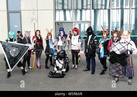 Entertainers dressed in cosplay costumes pose during the Shanghai ...