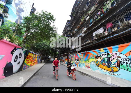 Colorful wall paintings feature giant pandas in an alley in Chengdu ...