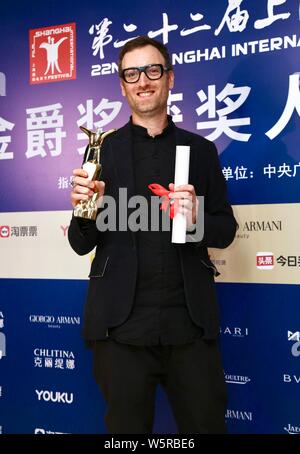 American born Jake Pollock poses with his trophy after winning "Best ...