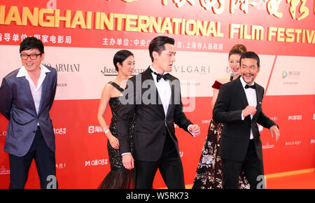 Chinese actors Hu Ge, left, and Liao Fan arrive on the red carpet for ...
