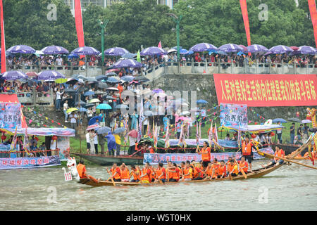 Competitors take part in a Dragon Boat Race to celebrate the Dragon ...