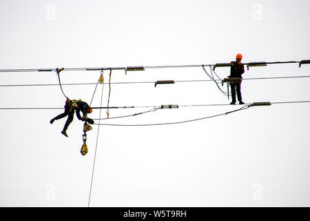 Chinese workers assemble power cables to connect Zhoushan's Jintang and ...