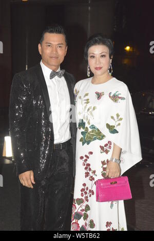 Hong Kong actor Ray Lui, right, poses with his wife Yang Xiaojuan ...