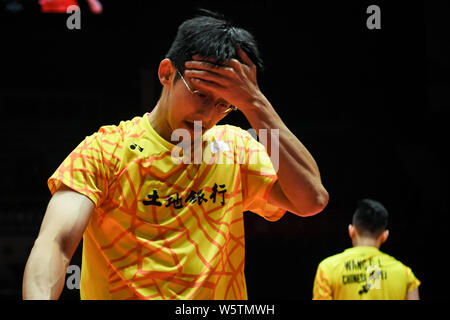 Chen Hung-ling and Wang Chi-lin of Chinese Taipei return a shot to Hiroyuki Endo and Yuta ...