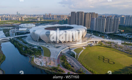 The main stadium of the Hangzhou Olympic Sports Center, resembling a ...