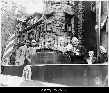 Photograph of President Truman with other dignitaries, waving as he ...