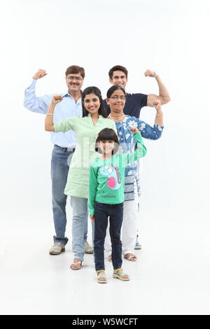 mother showing biceps muscle to her daughter at home Stock Photo - Alamy