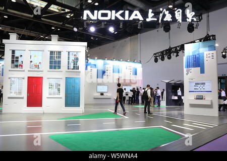 --FILE--People visit the stand of Nokia during an exhibition in ...