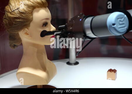A make-up robot of L'Oreal Paris is on display during the First China ...