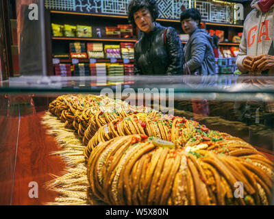 A giant traditional fried dough twisty snack Mahua weighing 59kg is on ...