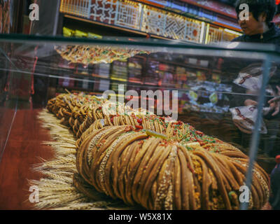 A giant traditional fried dough twisty snack Mahua weighing 59kg is on ...