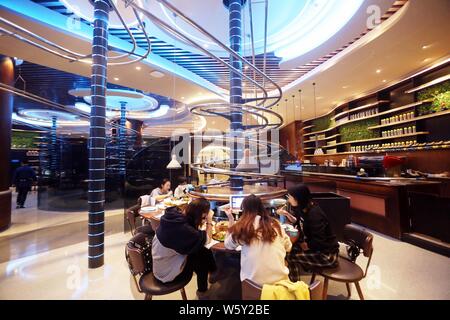 Customers dine in the world's tenth and Asia's third spaceship-themed ...