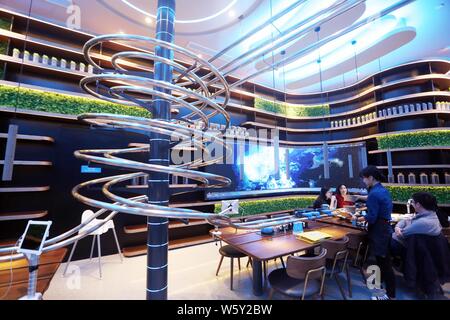 Customers dine in the world's tenth and Asia's third spaceship-themed ...