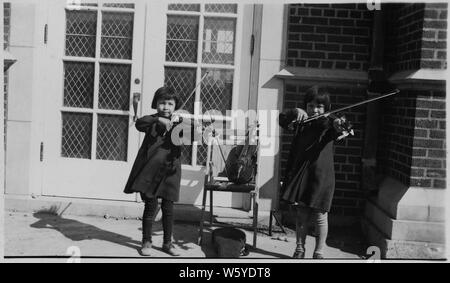 Two first graders playing violins Stock Photo - Alamy