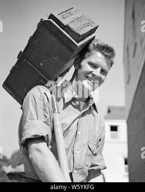 1940s YOUNG MAN CONSTRUCTION WORKER LABORER MOVING LOAD OF DIRT USING ...