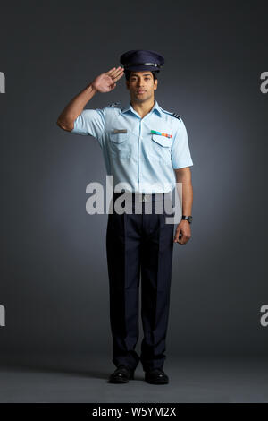 Portrait of an airforce pilot saluting Stock Photo - Alamy