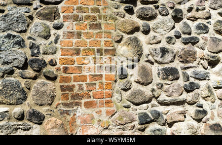 wall of field stones and red bricks Stock Photo - Alamy