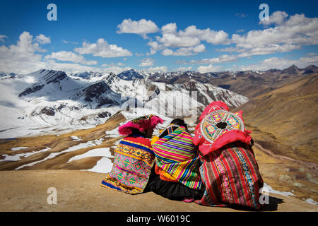 Indigenous Peruvian women and young girls in traditional costume, and ...