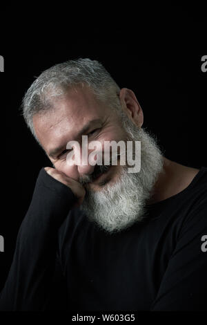 Handsome bearded man with lush hairstyle waving and wrapping in ...