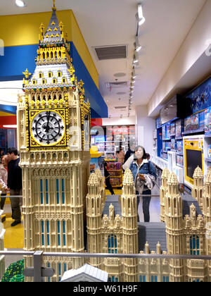 People visit the Lego Flagship store at Shanghai ShiMao Festival City ...