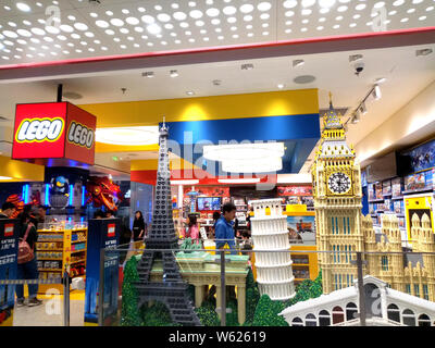 People visit the Lego Flagship store at Shanghai ShiMao Festival City ...