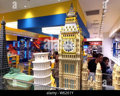 People visit the Lego Flagship store at Shanghai ShiMao Festival City ...