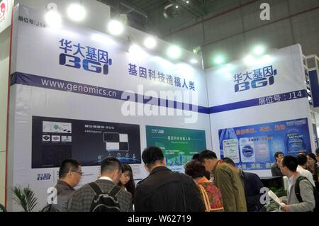 --FILE--People visit the stand of BGI Genomics during an exhibition in ...