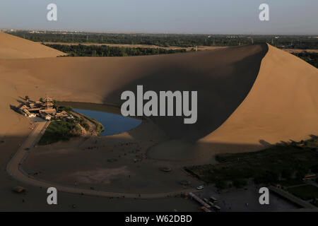 View of the Crescent Moon Lake, also known as Yueyaquan, surrounded by ...