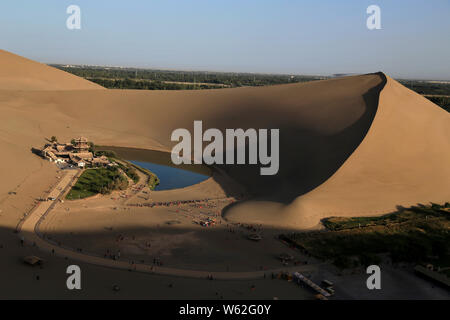 View of the Crescent Moon Lake, also known as Yueyaquan, surrounded by ...