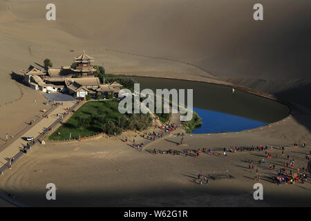 View of the Crescent Moon Lake, also known as Yueyaquan, surrounded by ...