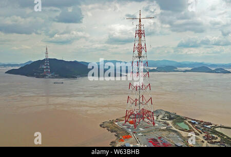 Aerial view of world's tallest transmission towers that support the 2,656-meter-long power ...