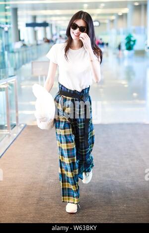 Chinese model He Sui arrives at the Shanghai Hongqiao International ...