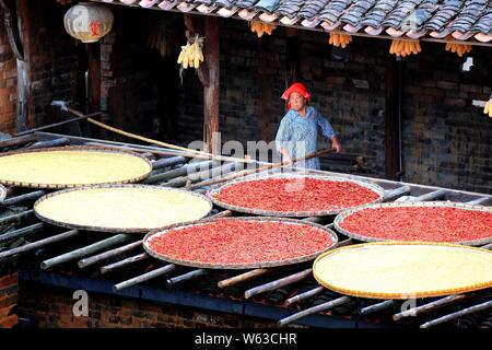 Villagers dry crops in the sun in Youyang County, Chongqing, China, 27 ...