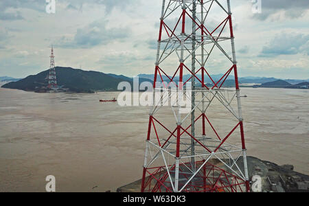 Aerial view of world's tallest transmission towers that support the 2,656-meter-long power ...