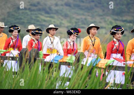 66 couples dressed in Mosuo people's traditional clothing take part in ...