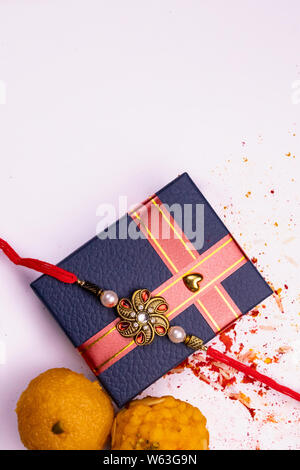 Top view of rakhi with kumkum and rice for raksha bandhan Stock Photo ...
