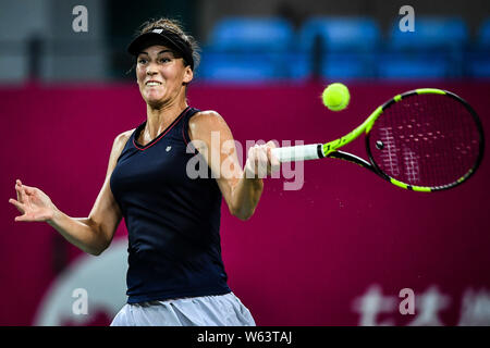 Aleksandra Krunic of Serbia returns a shot to Lesia Tsurenko of Ukraine ...