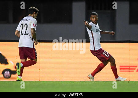Moroccan football player Ayoub El Kaabi, top, of Hebei China Fortune ...