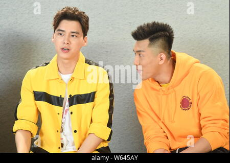 Chinese actor Li Yifeng, left, and Guo Ailun receive an interview for ...