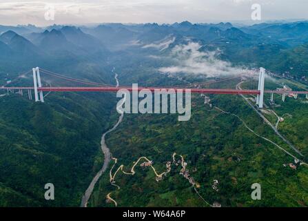 Aerial view of the Baling River Bridge 370 meters high over a valley in ...