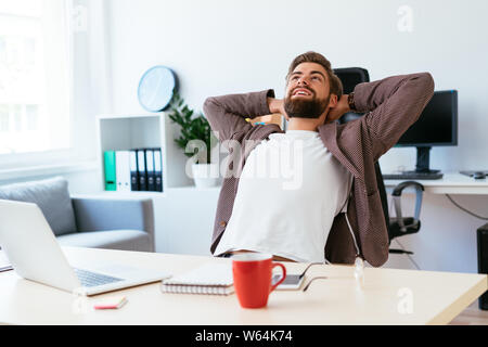 The businessman taking work home and working overtime Stock Photo - Alamy