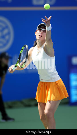 Danielle Collins, of the United States, serves to Naomi Osaka, of Japan ...
