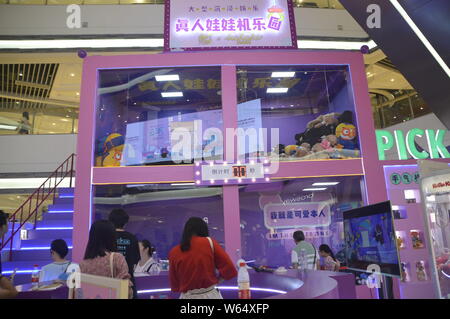 View of a two-storey human doll-grabbing machine, which is China's ...