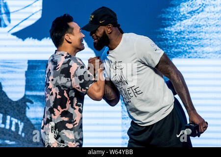 NBA star LeBron James, right, of Los Angeles Lakers attends the POWER ...